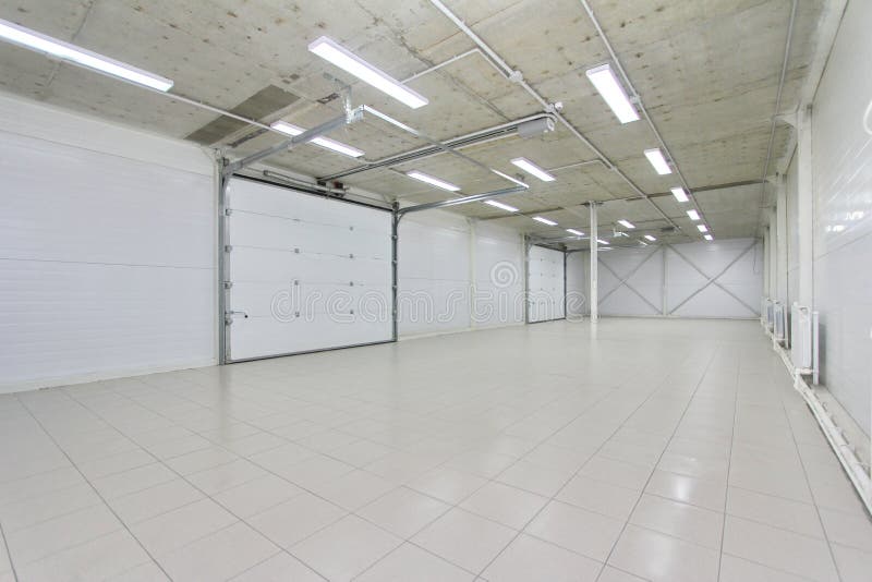 Empty Parking Garage, Warehouse Interior with Large White Gates and ...