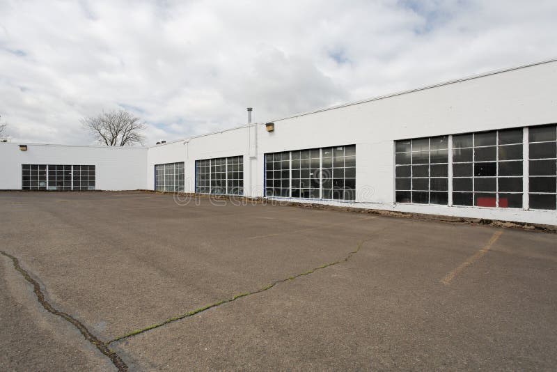 Empty Parking Lot Outside Commercial Warehouse Stock Image - Image of ...