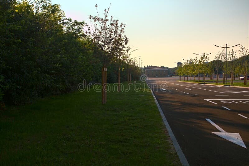 Empty Parking Lot with Trees and Grass at Sunset in Late Summer Stock ...