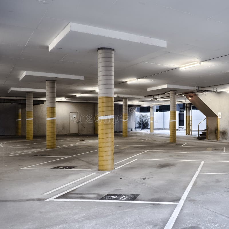 Empty Parking Undercroft with Yellow Pylons Stock Photo - Image of cold ...