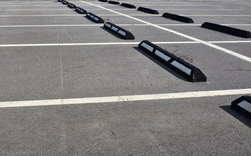 Empty Parking Space with White Lines and Curb Stops Stock Photo - Image ...