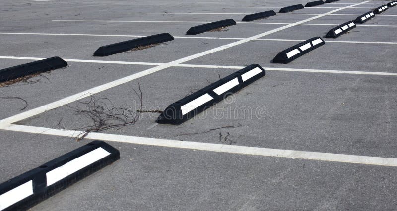 Empty Parking Space with White Lines and Curb Stops Stock Image - Image ...
