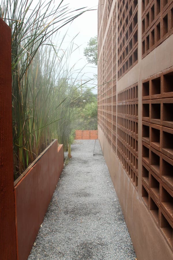 Pathway beside Building and Wall Stock Image - Image of pavement ...