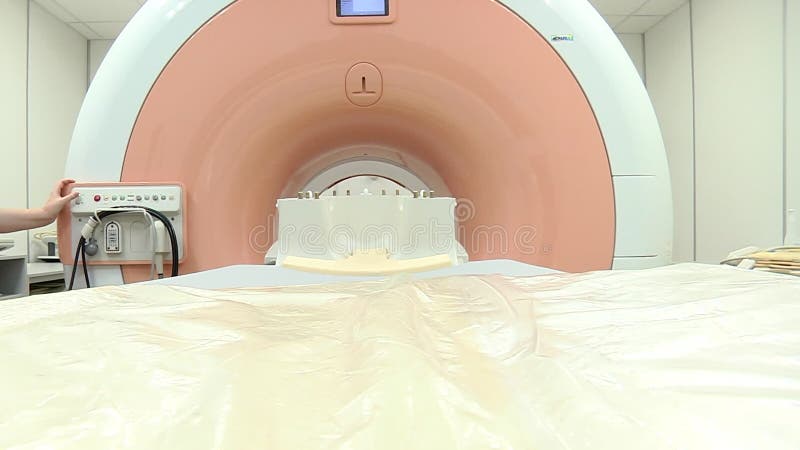 An Empty Patients Cot Moves Inside a CT Scanner. Stock Footage - Video ...