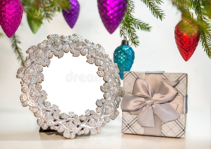 Empty Photo Frame with Present Under Decorated Pine Tree Branches Stock ...