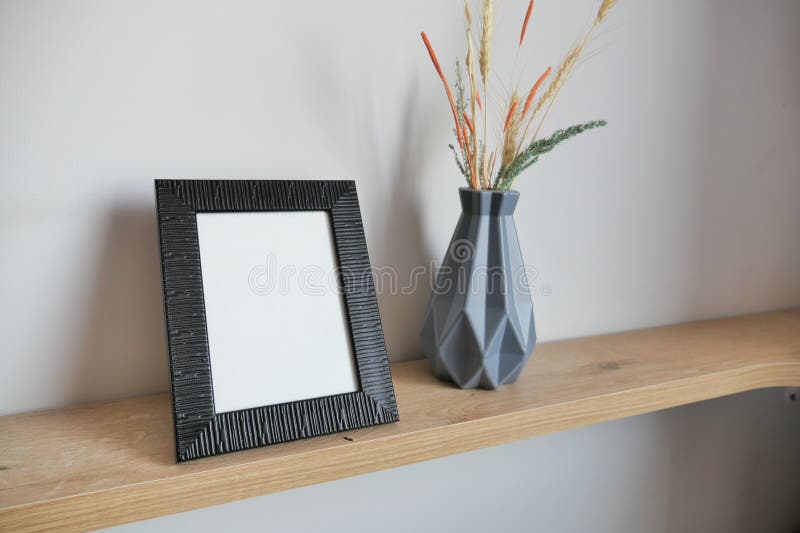 Empty Photo Frame on Table Against White Wall Stock Image - Image of ...