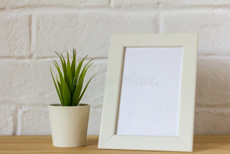 An Empty Photo Frame on a Table or Shelf with a Copy of the Space Stock ...