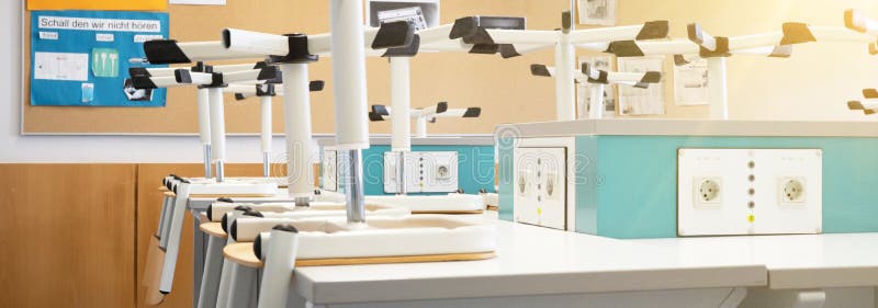 Empty Physics Room with High Chairs and Sockets on the Table Stock ...
