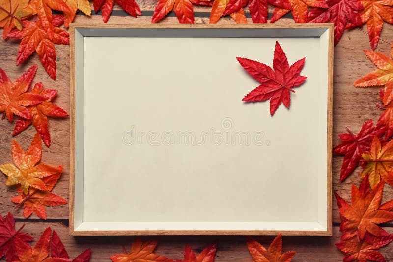 Picture Frame with Autumn Maple Leaves on Wooden Background. Stock ...