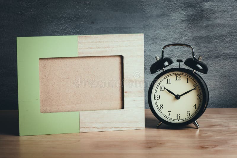 Empty Picture Frame with Clock on Table Stock Image - Image of hand ...