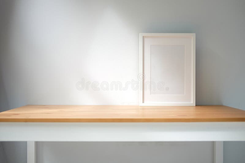 Empty Picture Frame on Wooden Table in Bright Living Room Stock Photo ...