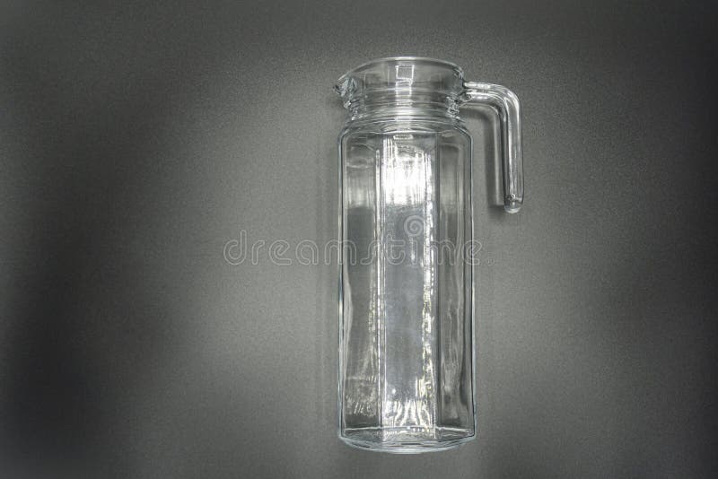 Empty Pitcher, Glass Jug Isolated on Gray Background Stock Photo ...