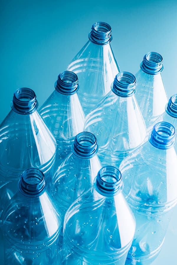 Empty Plastic Bottle and Various Fabrics Made of Recycled Polyester ...