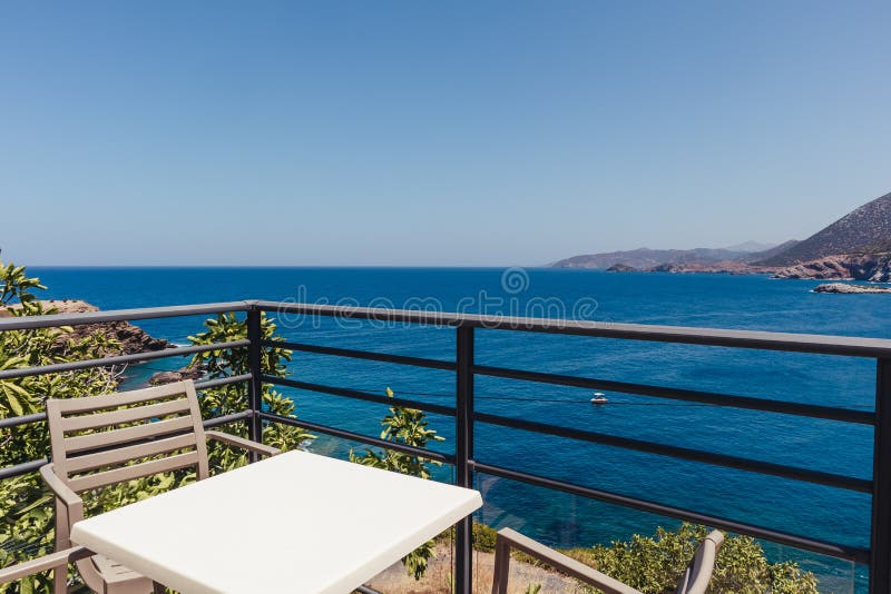 Plastic Chairs and Tables at an Outdoor Cafe on a Balcony with a View ...