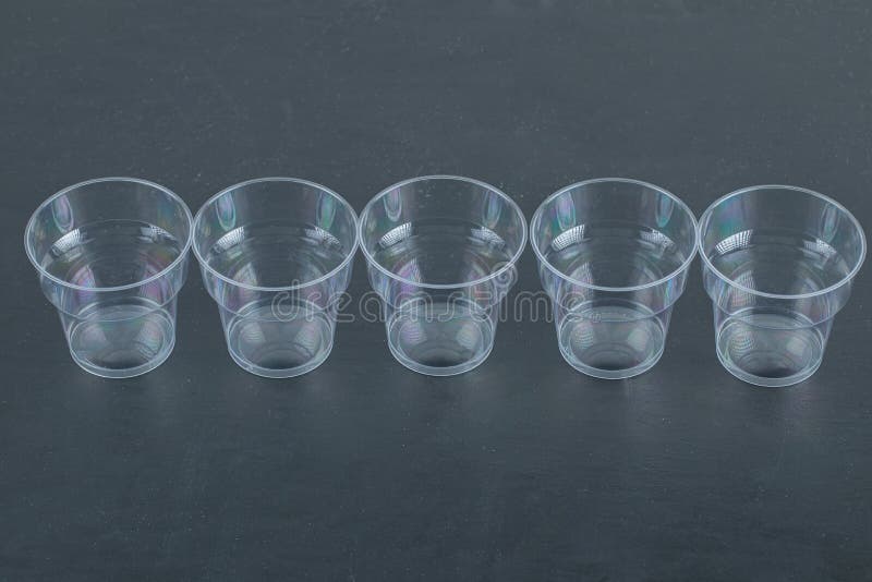 Empty Plastic Water Cups on Grey Background Stock Photo - Image of ...