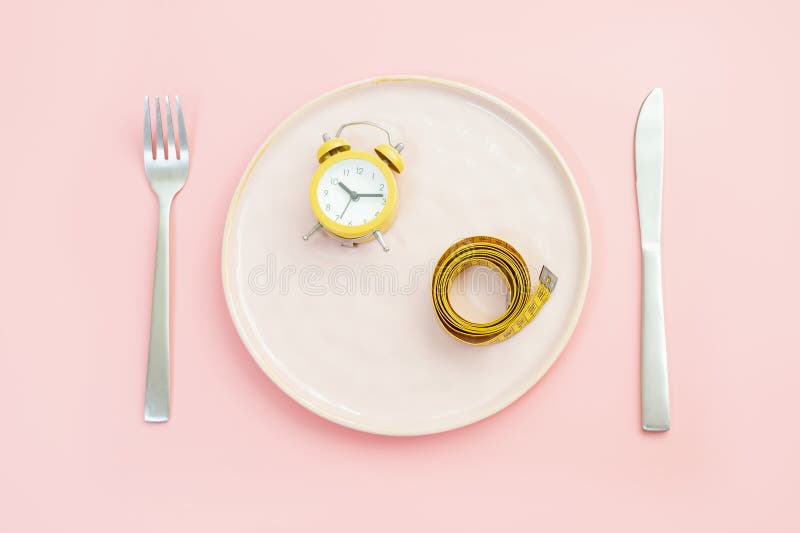Empty Plate with Alarm Clock and Measuring Tape on Pink Background ...