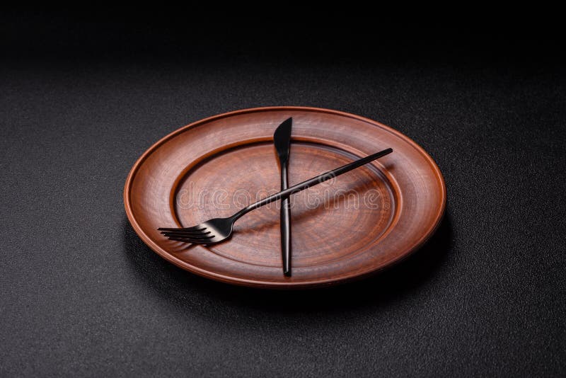 Empty Plate with Devices in the Form of Clock Hands As a Conceptual ...