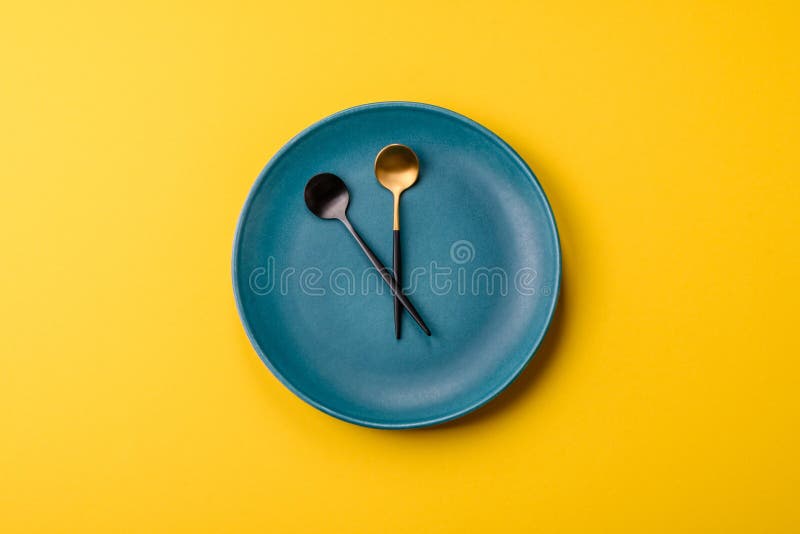 Empty Plate with Devices in the Form of Clock Hands As a Conceptual ...