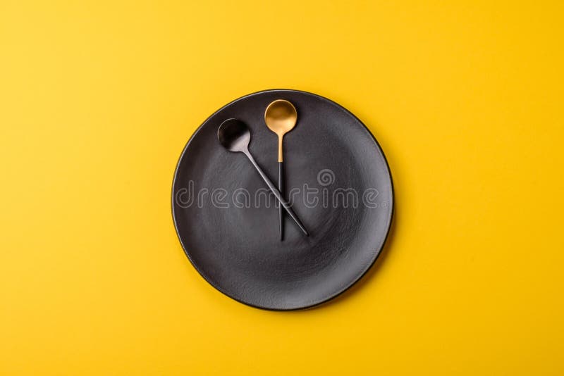 Empty Plate with Devices in the Form of Clock Hands As a Conceptual ...