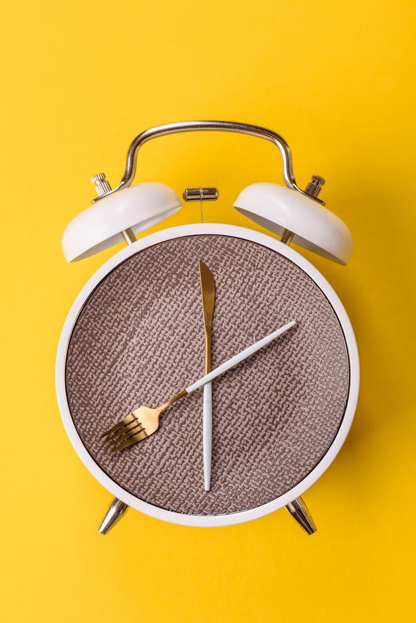 Empty Plate with Devices in the Form of Clock Hands As a Conceptual ...