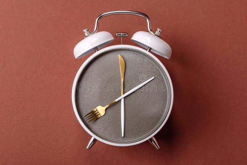 Empty Plate with Devices in the Form of Clock Hands As a Conceptual ...