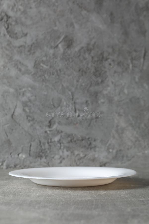 Empty Plate on Gray Textured Table, Space for Text Stock Photo - Image ...