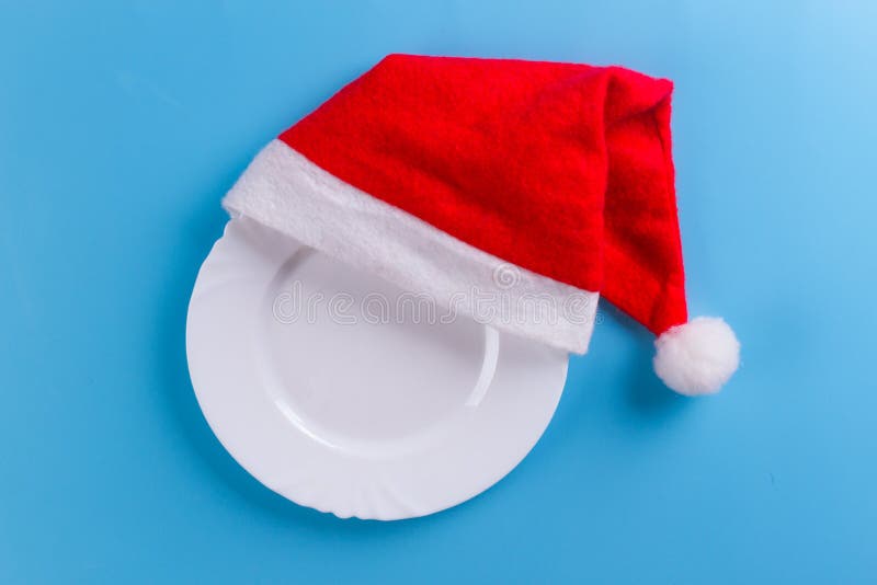 Empty Plate with Santa Hat on it Stock Photo - Image of fork, dinner ...