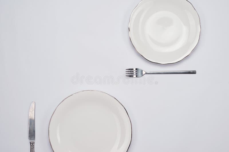 Empty Plate and Silverware Set on Wooden Table. Top View. Stock Photo ...