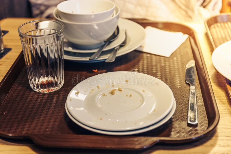 Empty Plates, Cutlery, a Glass on a Tray in a Cafe Stock Photo - Image ...