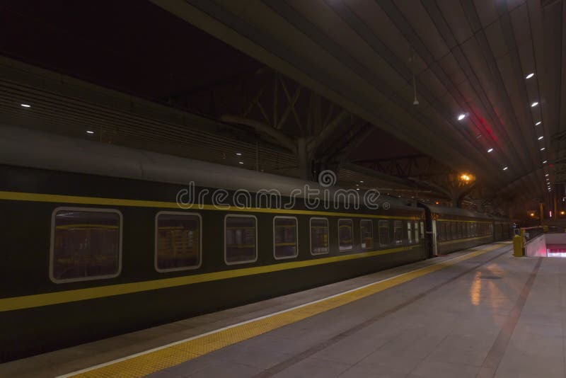 The Railway Platform and the Train at Night. Stock Photo - Image of ...