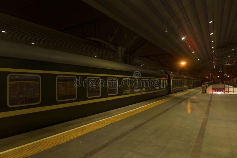 The Railway Platform and the Train at Night. Stock Photo - Image of ...