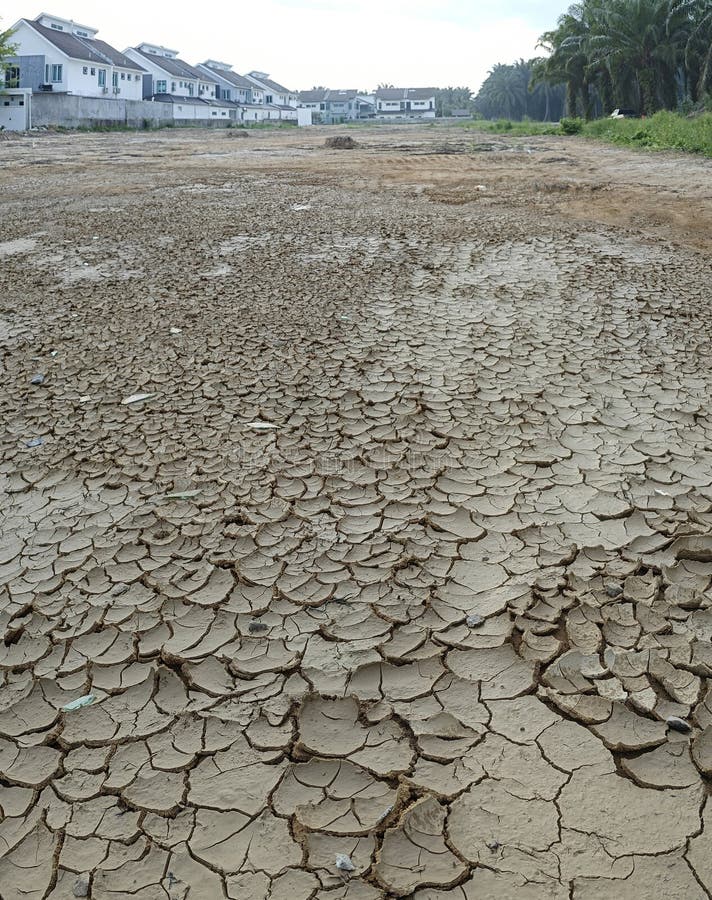 An Empty Plot of Land Scene Besides a Residential Row of Houses. Stock ...