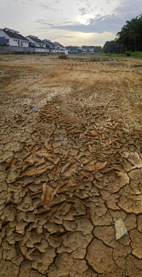 An Empty Plot of Land Scene Besides a Residential Row of Houses. Stock ...