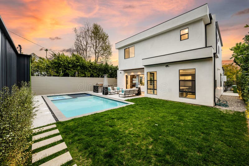 The Pool is Empty and There are Green Grass Around it Stock Photo ...