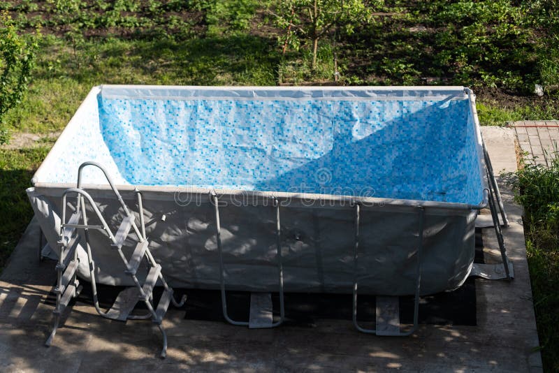 Empty pool in the yard. stock photo. Image of cool, ladder - 252724212