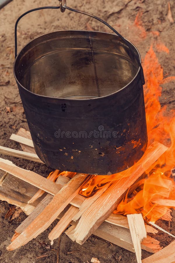 Empty Pot Hanging Over a Burning Fire Stock Photo - Image of metal ...