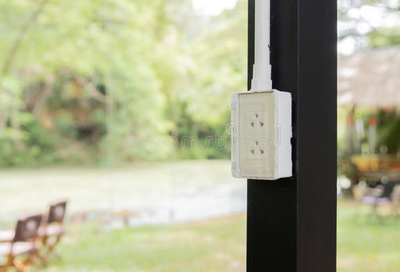 Empty Power Socket Setting on Black Steel Pole at Outdoor Cafe for ...