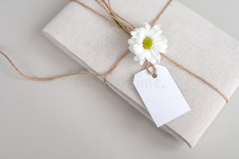 Empty Price Tag on White Fabric, Gift Linen Fabric with a Tag on a ...