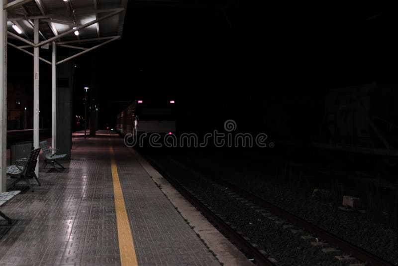 Empty Rail Road Station at Night. the Train is Going on the Tracks ...