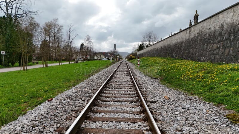 Empty Railroad Track Flanked by Stone Wall and Trees Stock Image ...