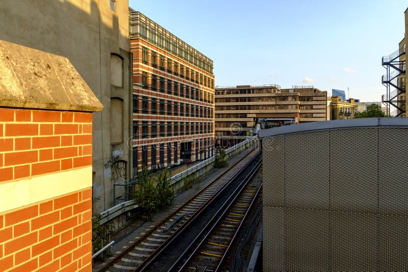 Empty Railroad Tracks from between Buildings Stock Image - Image of ...