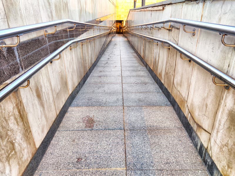 An Empty Ramp Descends into an Underground Space, Illuminated by Soft ...
