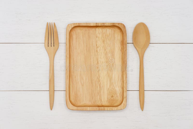 Empty Rectangle Wooden Plate with Spoon and Fork on White Wooden Table ...