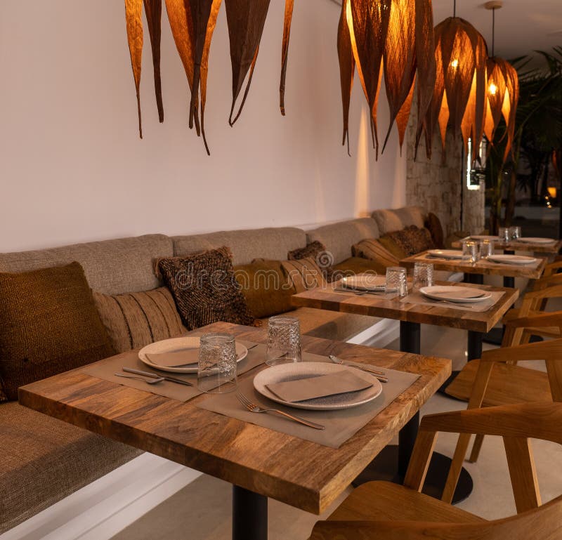 Empty Restaurant of a Rustic Hotel with Tables Prepared for Dinner in a ...