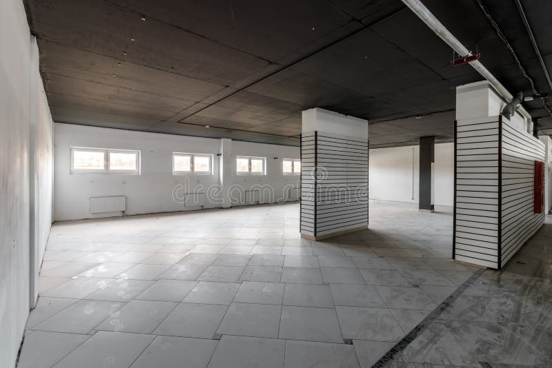 Empty Retail Space with a Black Ceiling and a Dirty Floor, Immediately ...