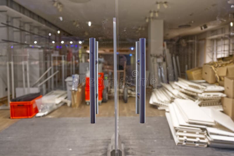 Empty Retail Space with Glass Doors and Boxes Stock Photo - Image of ...