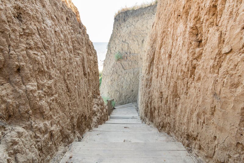 Empty Road at the Bottom of the Abyss in Sandy Soil Stock Photo - Image ...