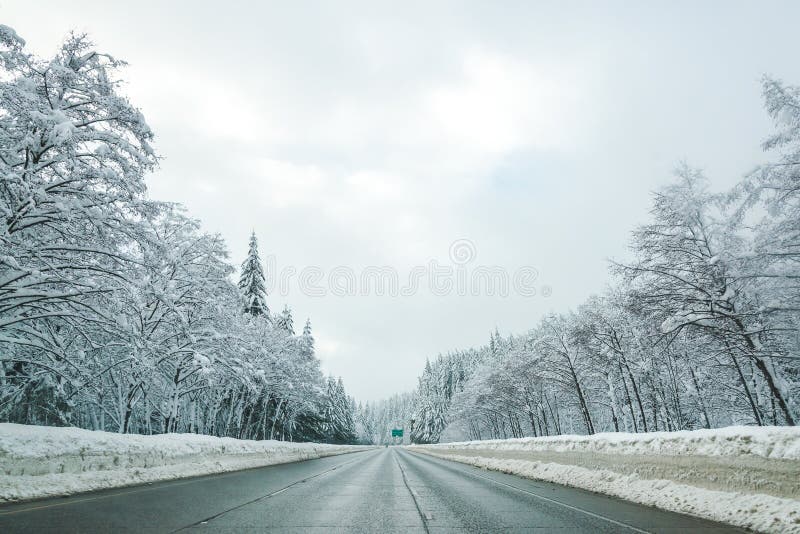 Empty Road with High Snow Level Covered Landscape in Winter Season ...
