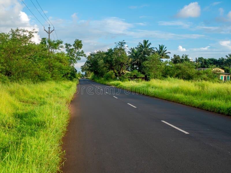 Empty Road with Lush Green Grass and Trees. Rural India Stock Photo ...