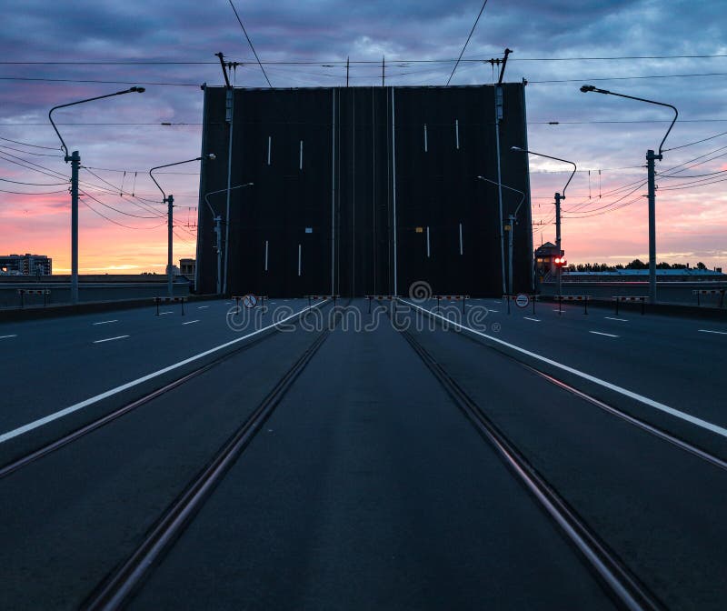 Empty Road with Rails at a Posh Dawn Against the Backdrop of a ...
